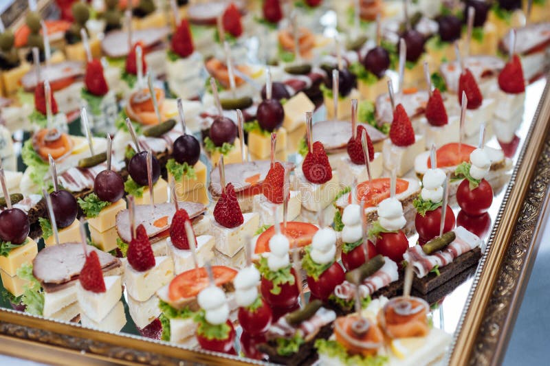 A Large Selection of Various Snacks for Guests on a Mirror Surface ...