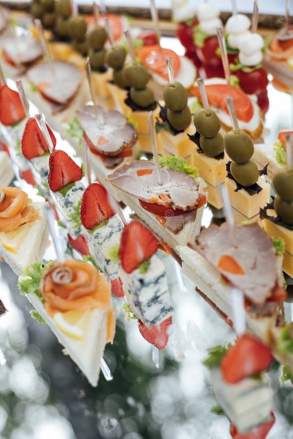 A Large Selection of Various Snacks for Guests on a Mirror Surface ...