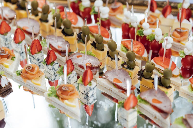 A Large Selection of Various Snacks for Guests on a Mirror Surface ...