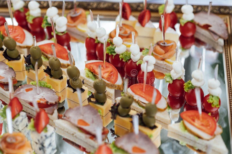 A Large Selection of Various Snacks for Guests on a Mirror Surface ...