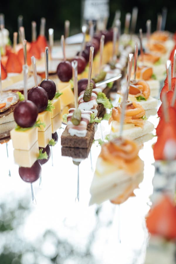 A Large Selection of Various Snacks for Guests on a Mirror Surface ...