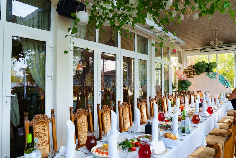 A Large Served Festive Table and a Photo Zone for the Holiday. Stock ...