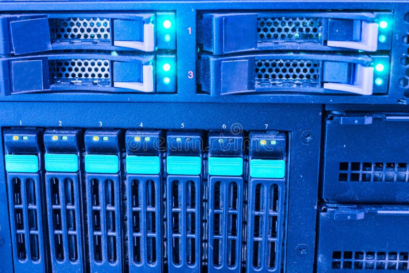A Large Server with a Lot of Slots for Hard Drives Works in the Server ...