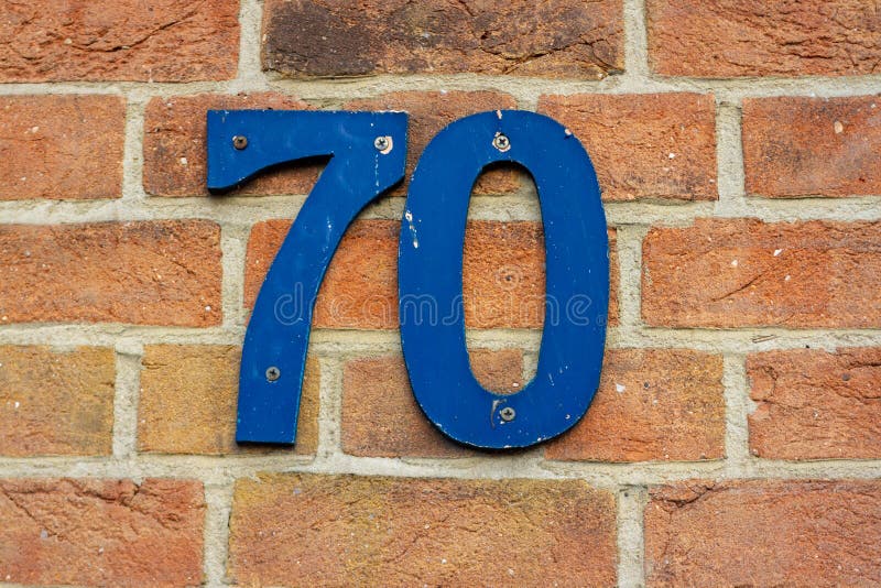 Big and Bold Blue House Number 70 Stock Image - Image of street ...