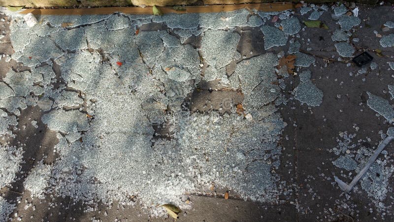 A Large Sheet of Glass Disintegrated and Cracked into Small Pieces ...