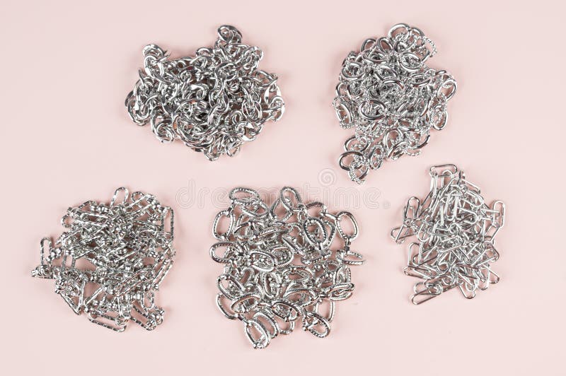Large Shiny Metalic Silver Chains on Pastel Surface Top View. Set of ...