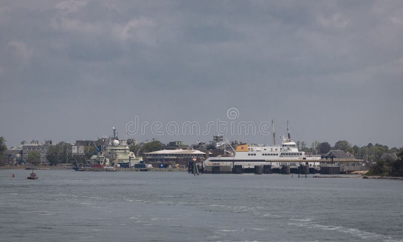 Large Ship Docked at a Pier in the Crystal Blue Ocean in Cape Cod Stock ...