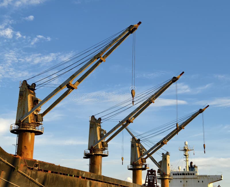 A Large Ship Equipped with Cranes Mounted on Its Side Stock Photo ... A Large Ship Equipped with Cranes Mounted on Its Side Stock Photo ...