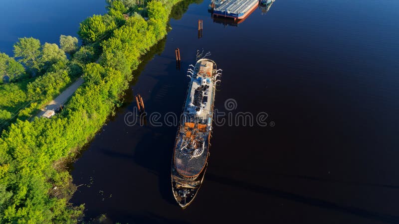 Large Ship is Floating in the Water with a Forest in the Background ...