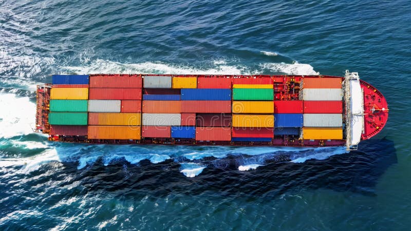 A Large Ship with Many Containers on it is Sailing through the Ocean ...