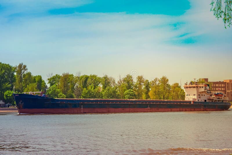 A Large Ship is Sailing on the River. Cargo Ship Stock Image - Image of ...