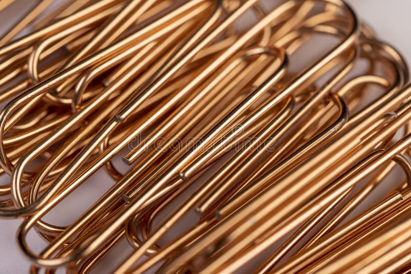 Large-sized Copper Paper Clips Lie on White Blank Paper Stock Image ...