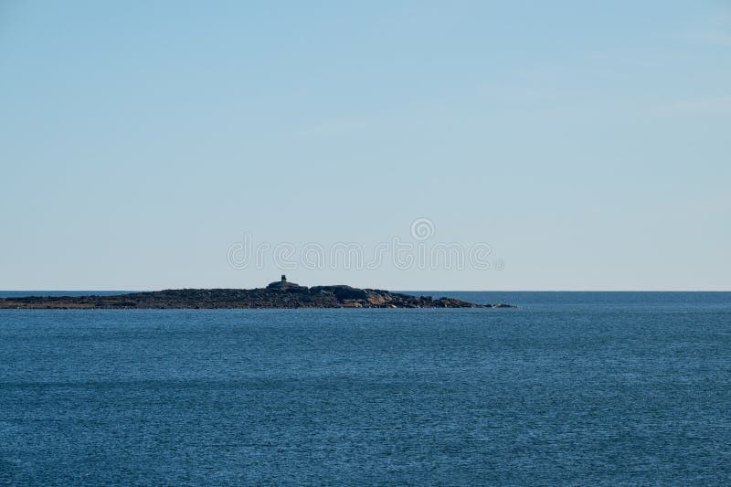 Large skerry in the sea.. stock photo. Image of boats - 354847128