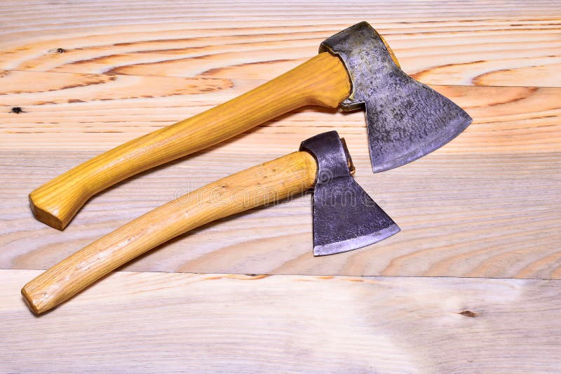 Large and Small Carpenter Axes on a Smooth Wooden Surface, Top View ...