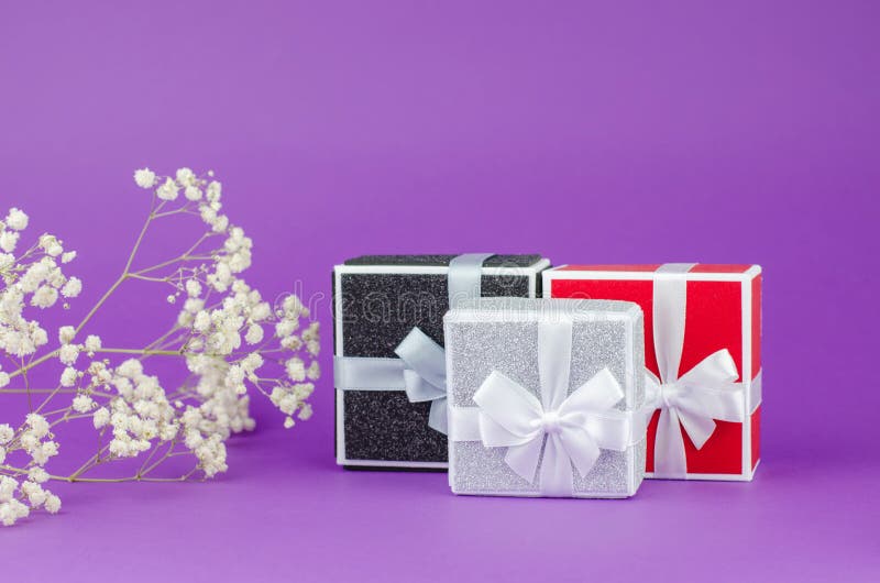 Large and Small Gift Boxes on a Purple Background Stock Photo - Image ...