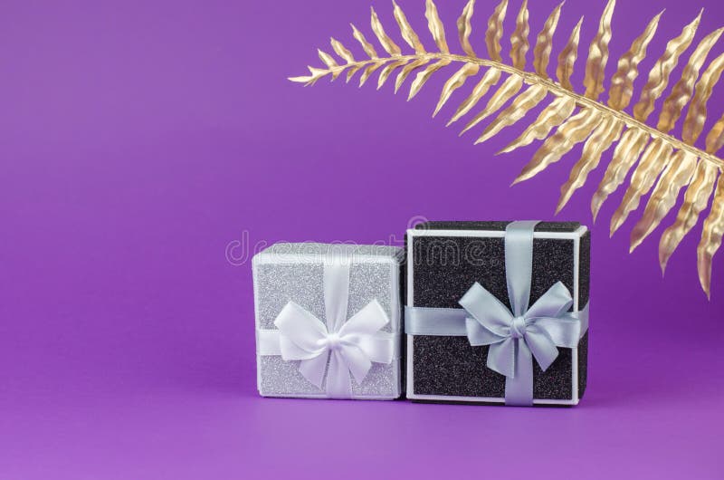 Large and Small Gift Boxes on a Purple Background Stock Image - Image ...