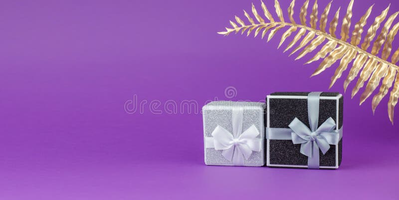 Large and Small Gift Boxes on a Purple Background Stock Photo - Image ...