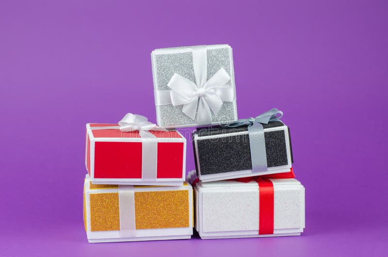 Large and Small Gift Boxes on a Purple Background Stock Photo - Image ...