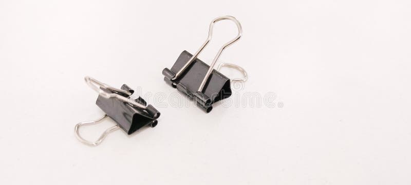 Large and Small Paper Clips Facing Each Other Stock Photo - Image of ...