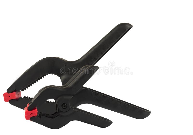 Large and Small Plastic Clamps on a White Background Stock Image ...