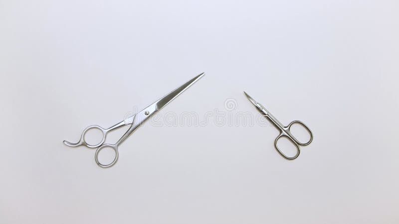 Large and Small Scissors Appear on the Table with Animation. Stock ...