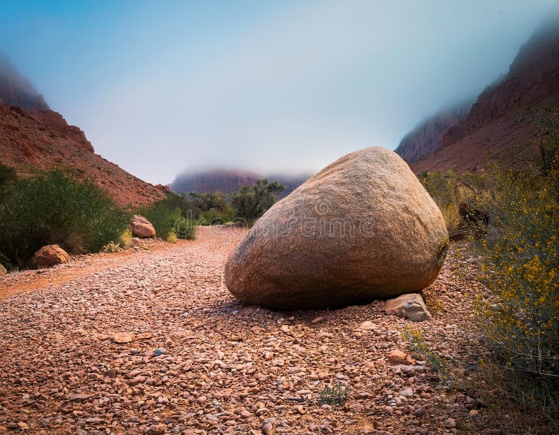 A Large, Smooth Boulder Surrounded by Tiny Pebbles and Rugged Gravel ...