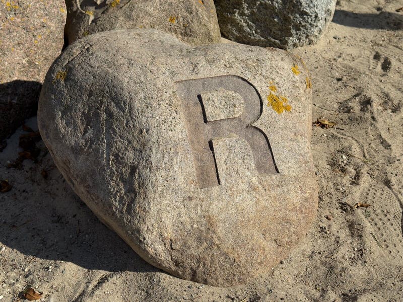Carved Rock with Letter R stock photo. Image of grave - 366159482