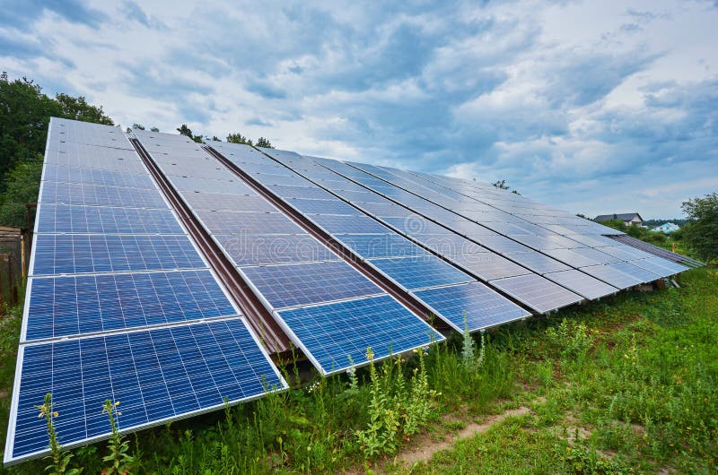 Large Solar Energy System, Ground Mounted Solar Panel Against Blue Sky ...
