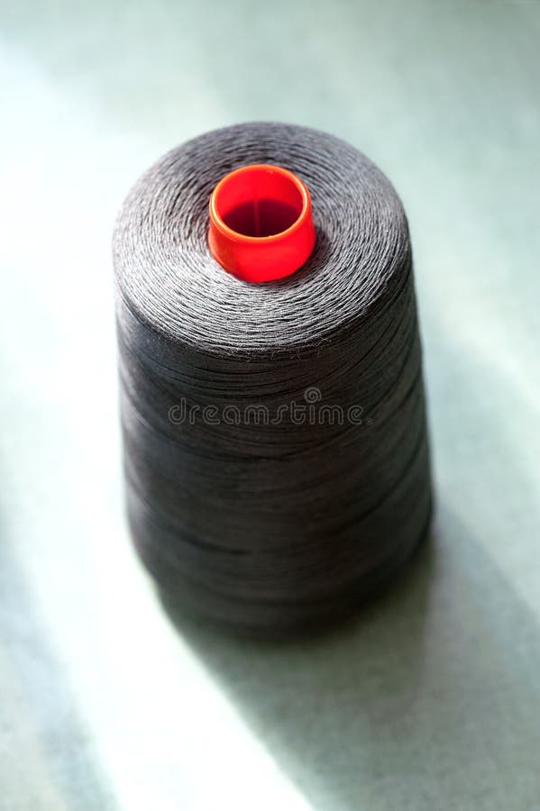Spool of Black Nylon Thread. a Small Part of the Thread from the Spool ...
