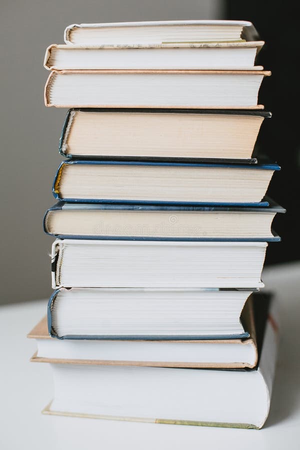 A Large Stack of Different Books on a Table Close-up Stock Image ...