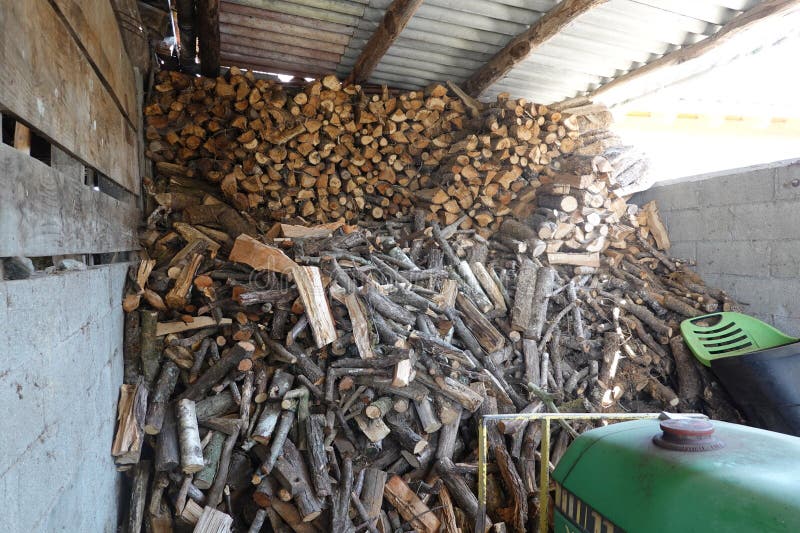 Large Stack of Firewood in a Rustic Shed Stock Image - Image of rustic ...