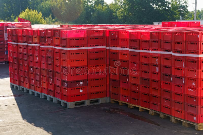 Large Stack of Red Plastic Boxes in the Parking Lot Stock Image - Image ...