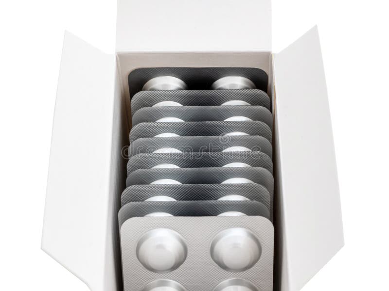 A Large Stack of Tablets in a Silver Package on a White Background ...
