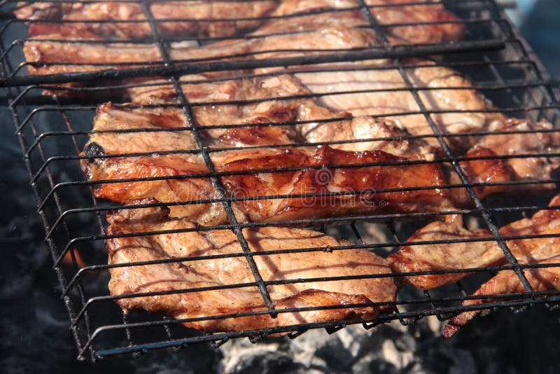 A Large Steak of Grilled Meat with Smoke. Cooking in the Open Air Stock ...