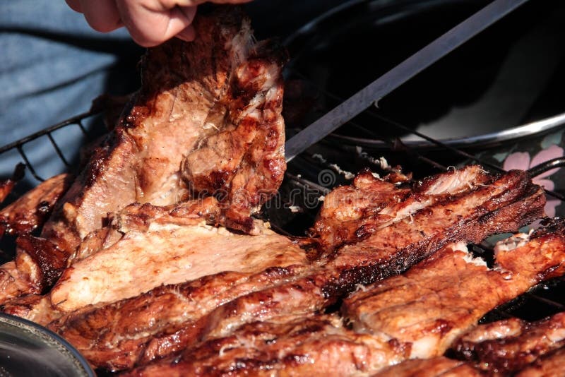 A Large Steak of Grilled Meat with Smoke. Cooking in the Open Air Stock ...