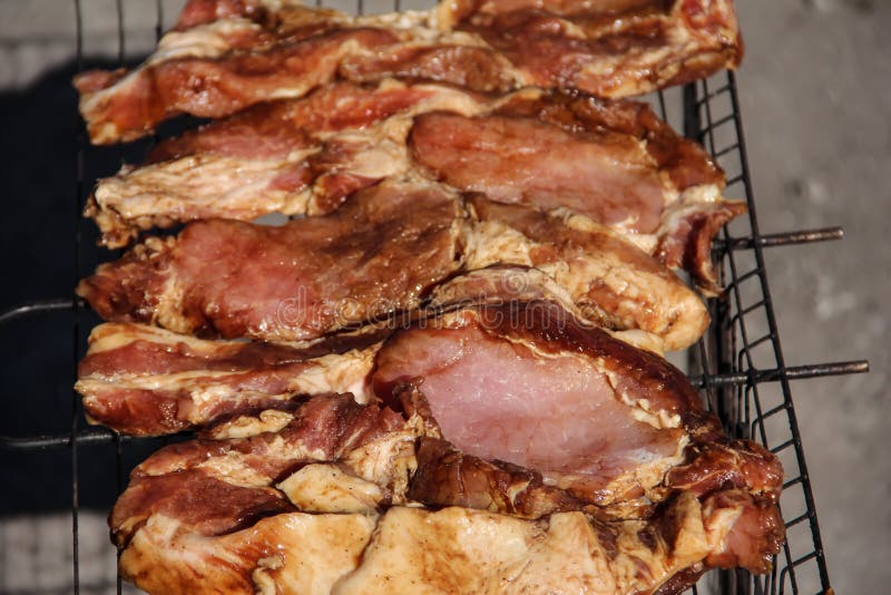 A Large Steak of Grilled Meat with Smoke. Cooking in the Open Air ...