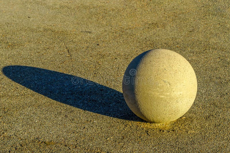A Large Stone Ball Lies on a Pavement. Stock Image - Image of subject ...