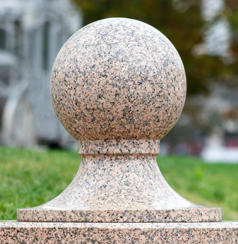 A Large Stone Ball Sits on Top of a Stone Base Stock Photo - Image of ...