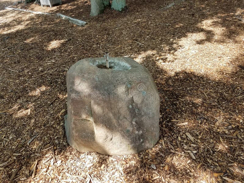 Large Stone or Boulder with Metal Pipe in it Stock Image - Image of ...
