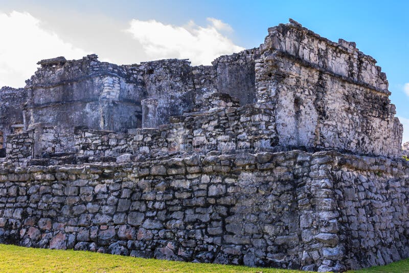 A Large Stone Building with a Grassy Area in Front of it Stock Image ...