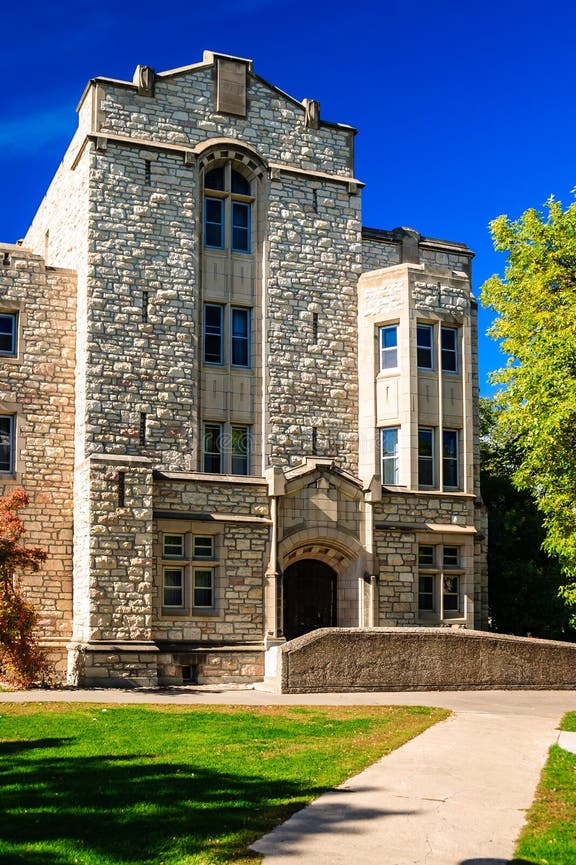 A Large Stone Building with a Large Window on the Front Stock Photo ...