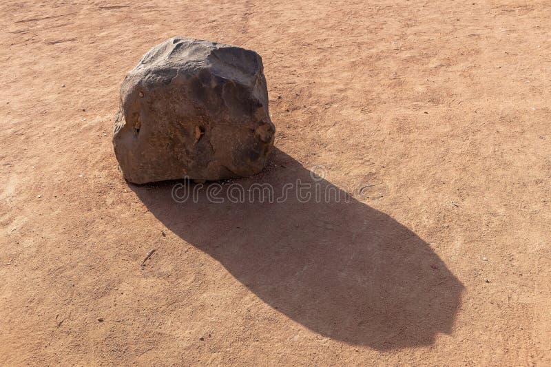 A Large Stone and Its Shadow on Dry Ground Stock Image - Image of ...