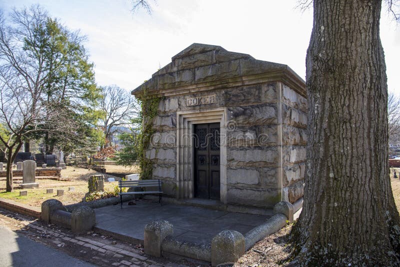 A Large Stone Mausoleum in the Graveyard with Bare Winter Trees and ...