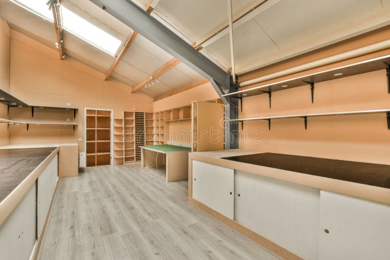 A Large Storage Room with Shelves and Counters in it Stock Image ...