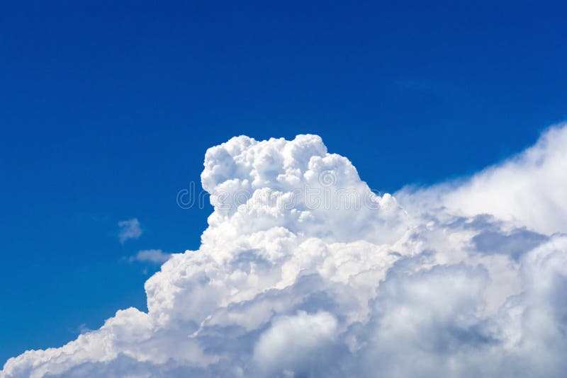 A Large Storm Cloud on Blue Sky Announces the Approaching Storm and the ...