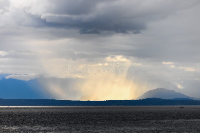 Large Storm Over the Ocean with Stormy Clouds and Mountains Stock Photo ...