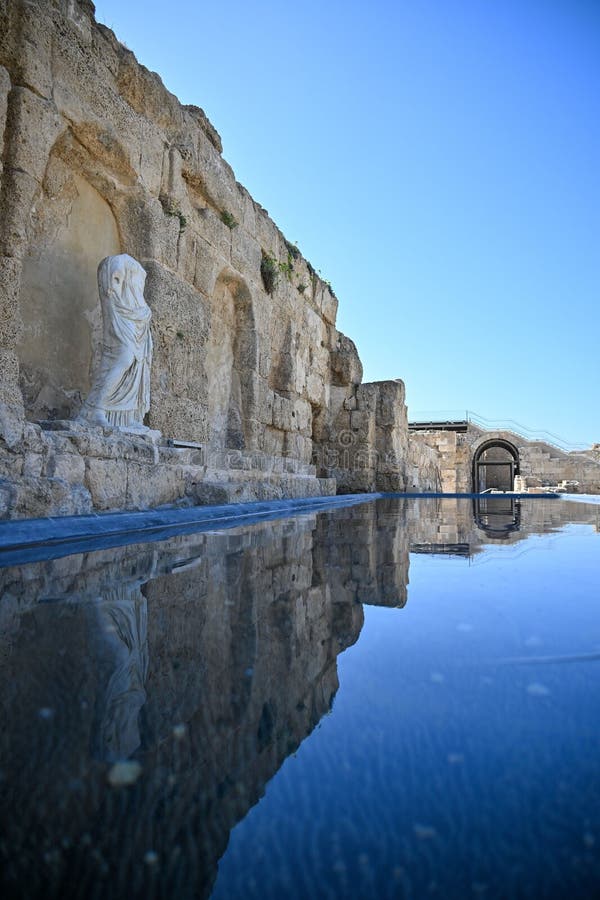 Large Structure with Statues at Its Base Against Blue Water Stock ...