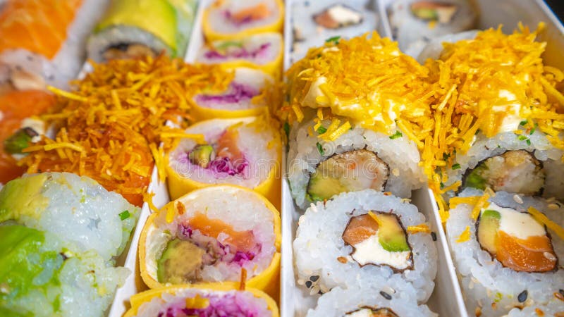 Large Sushi Set on Black. an Assortment of Various Maki, Nigiri and ...