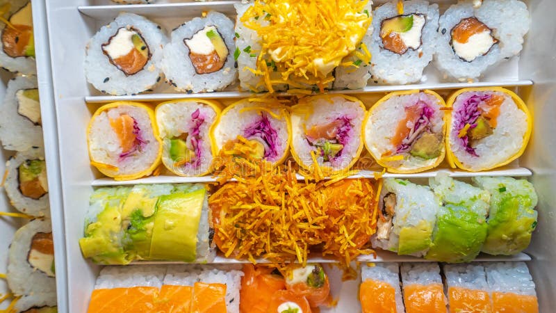 Large Sushi Set on Black. an Assortment of Various Maki, Nigiri and ...