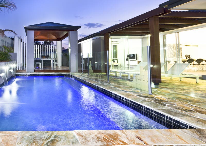 A Large Swimming Backyard Pool in Modern House Stock Image - Image of ...